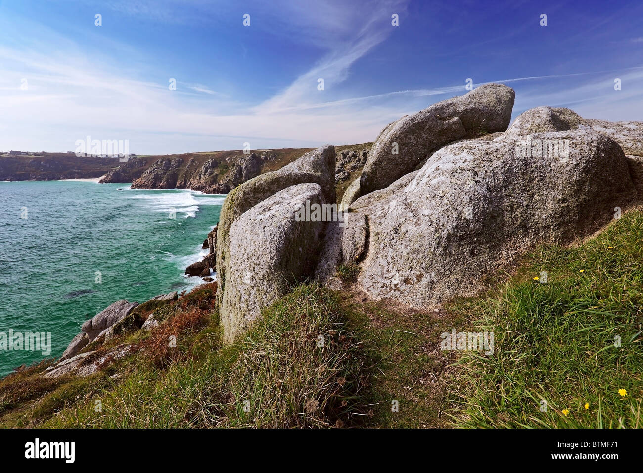 View towards Porthcurno beach and Minack Theatre from Logan Rock, near ...