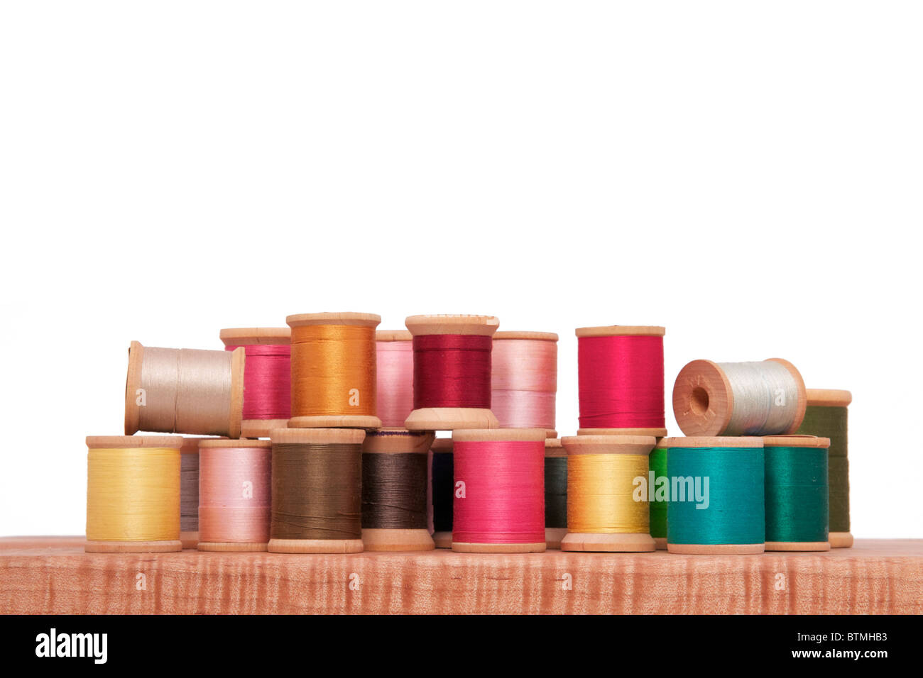 Various Spools of Colorful Thread on a White Background Stock Photo - Alamy
