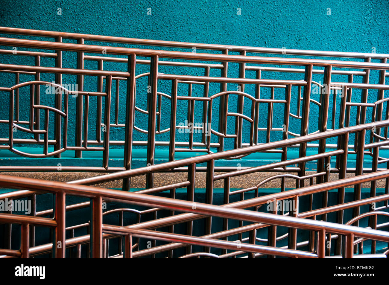 Metal handrail to guide people through lines Stock Photo - Alamy