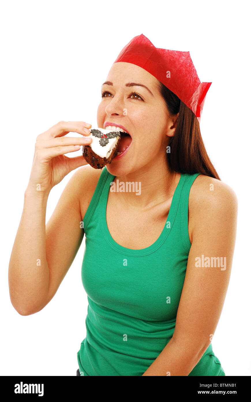 Woman biting christmas cake hi-res stock photography and images - Alamy