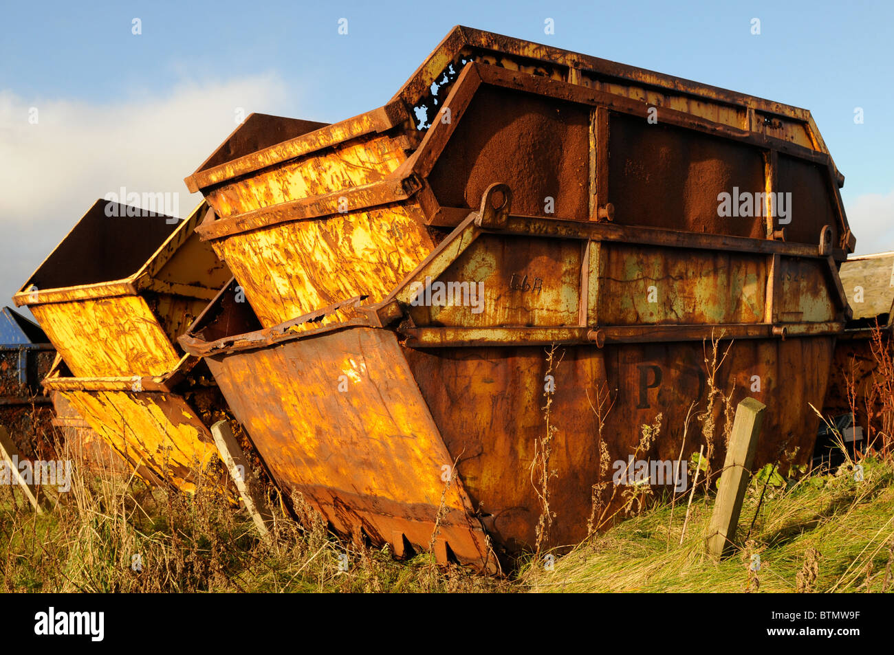 Old redundant skips Stock Photo - Alamy