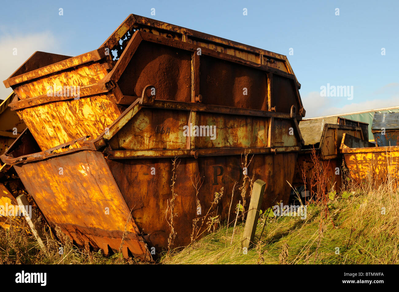 Old redundant skips Stock Photo - Alamy