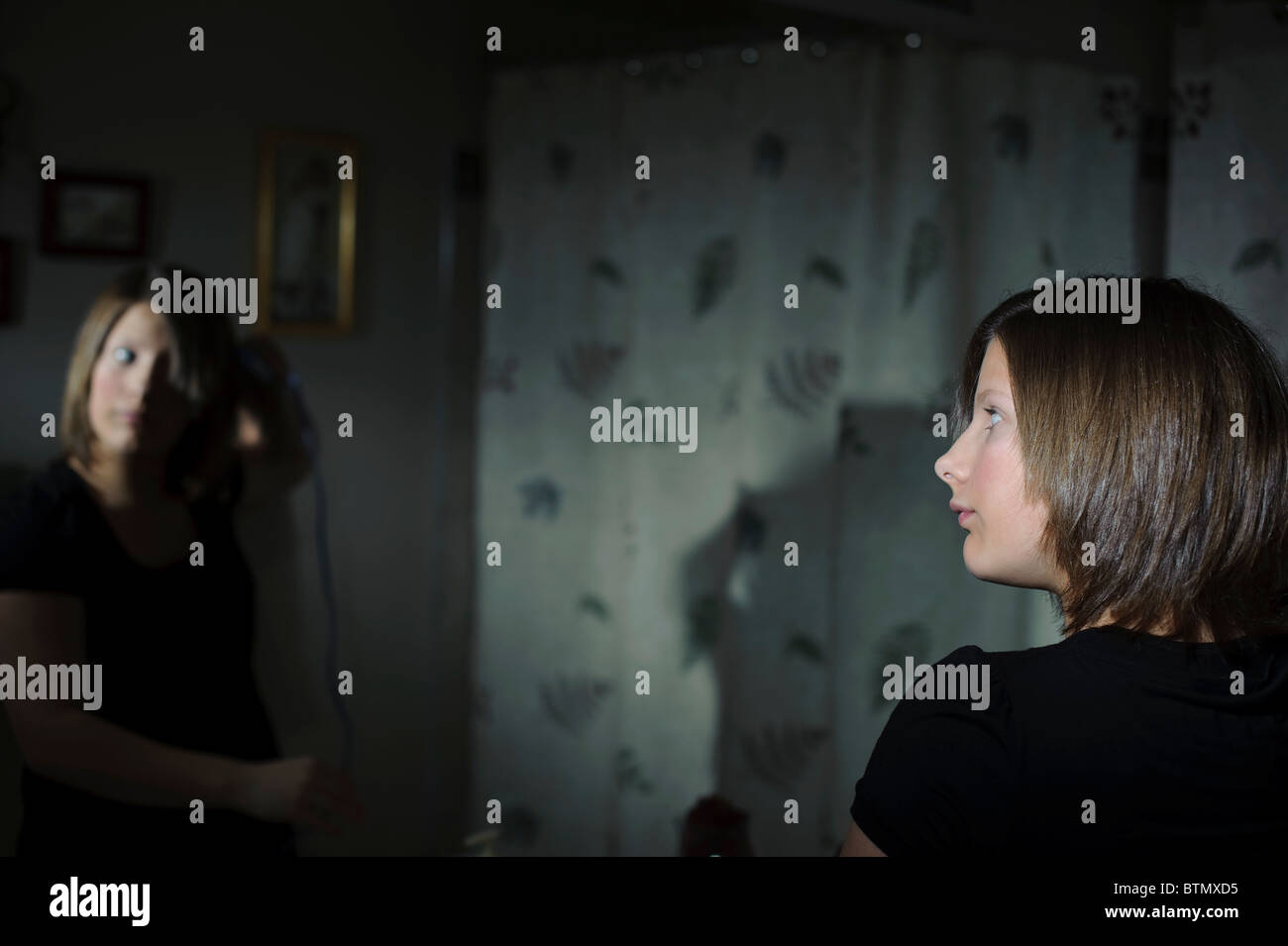 A teenage girl getting ready in the bathroom Stock Photo - Alamy