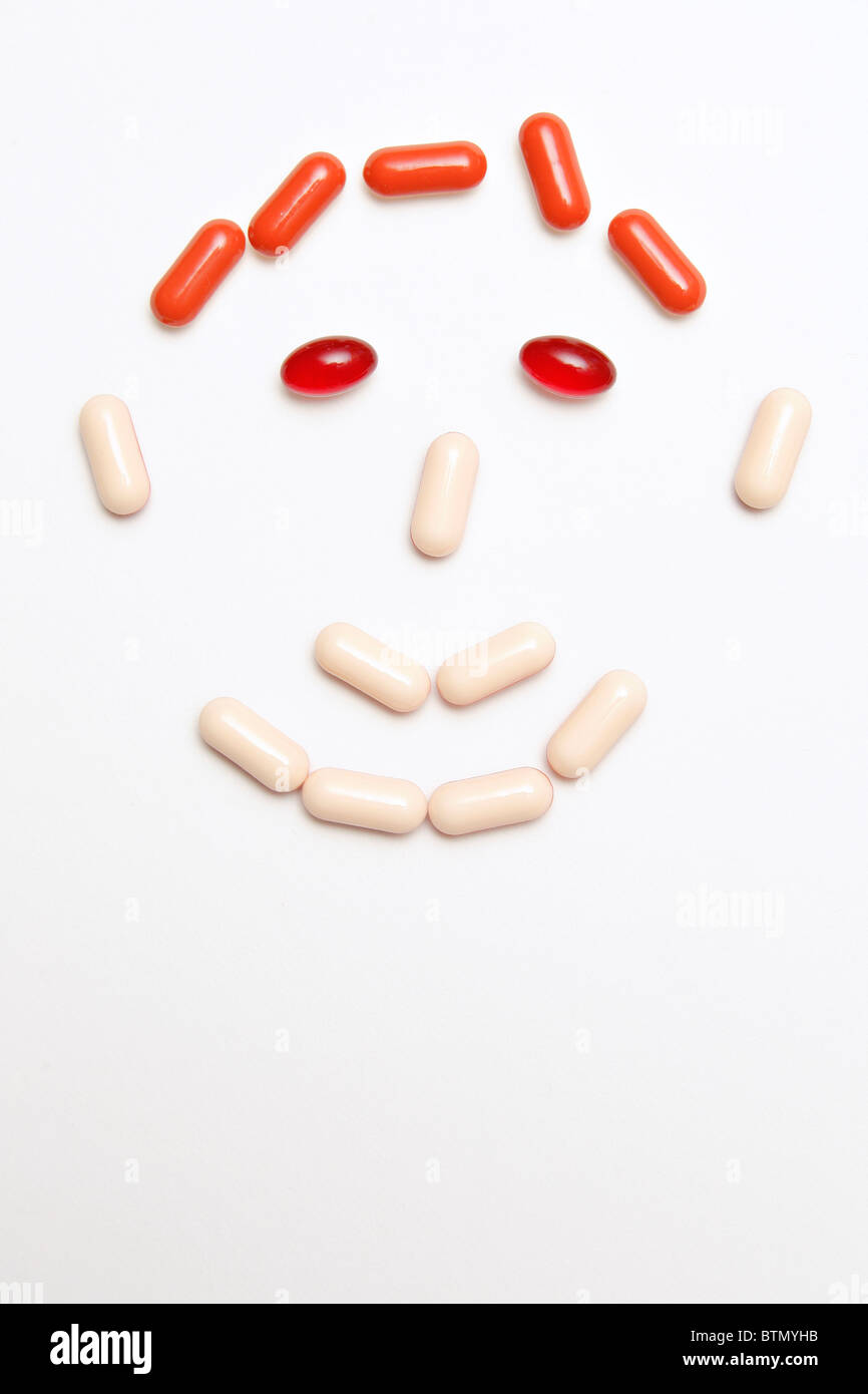 medication and pills face on gray background Stock Photo - Alamy