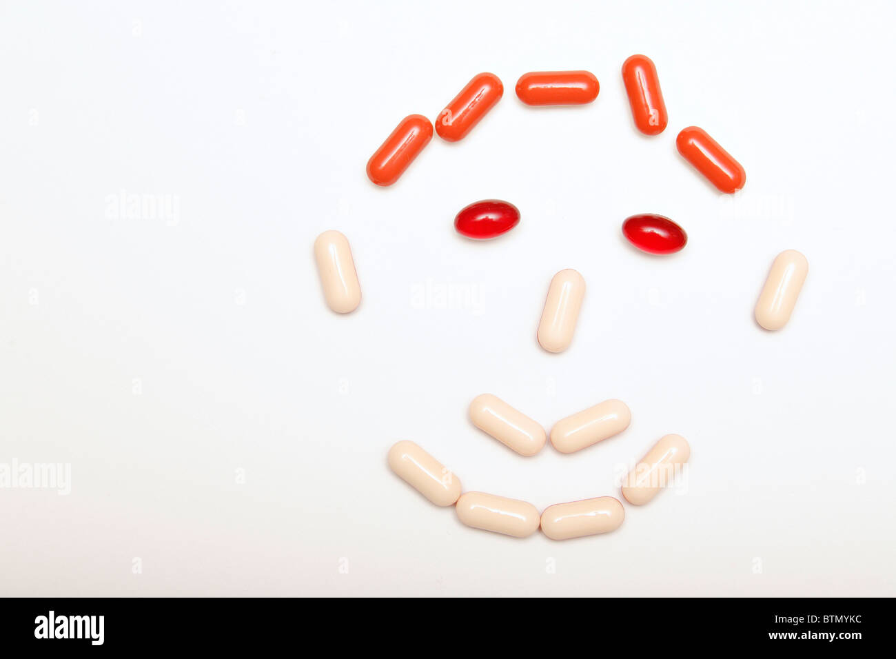 medication and pills face on gray background Stock Photo - Alamy