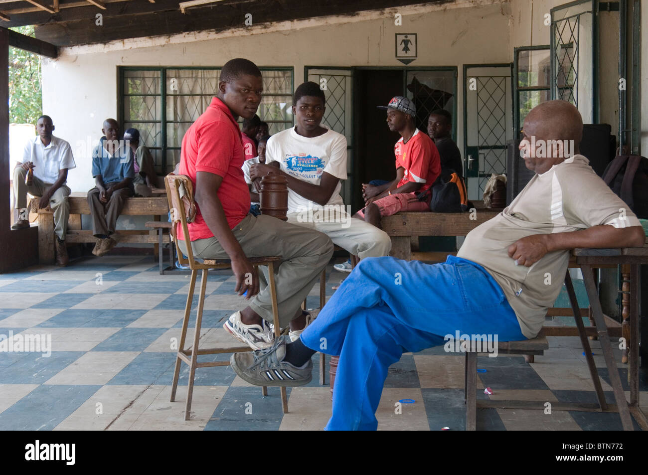 Patrons of the Falls Nightclub, a working man's bar in Victoria Falls ...