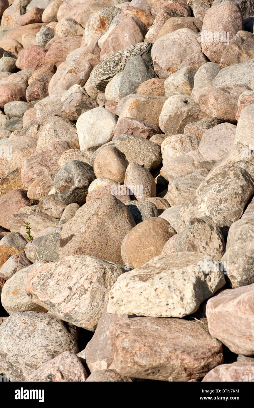 A large pile of rocks on the shore of a river Stock Photo - Alamy