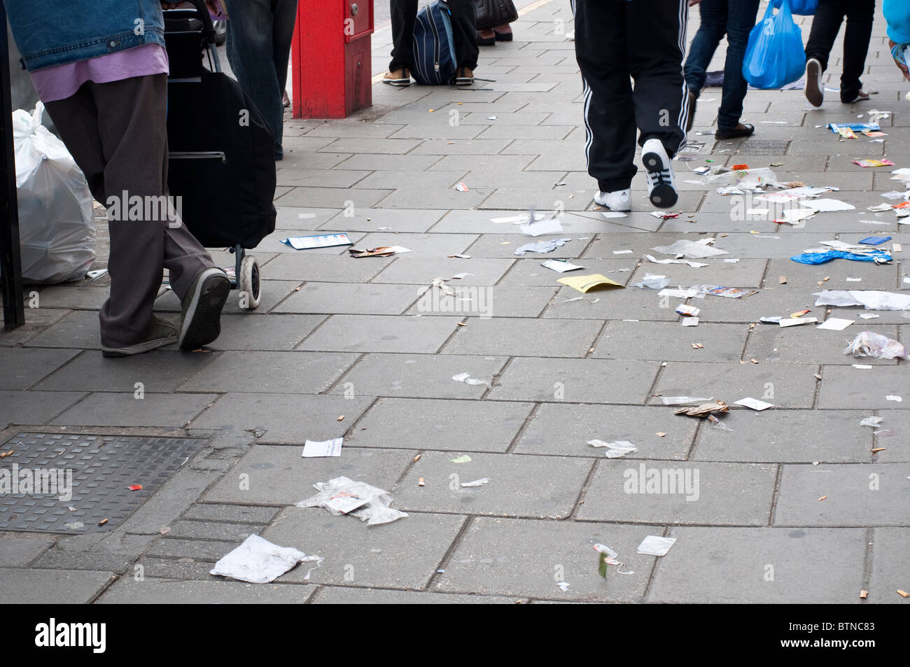 Rubbish and litter on the pavement on Dalston's high street, Kingsland ...