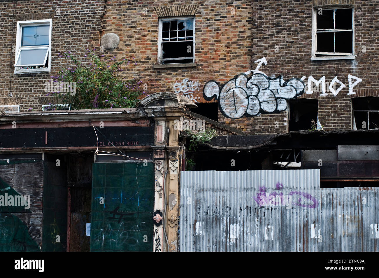 Derelict abandoned buildings shopfronts covered hi-res stock ...