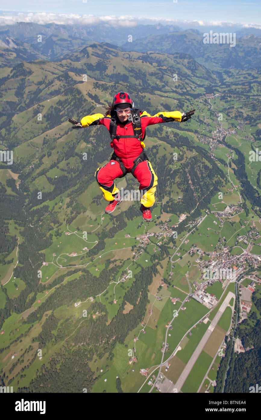 Girl is training sit fly position in freefall with 120 MPH over a ...