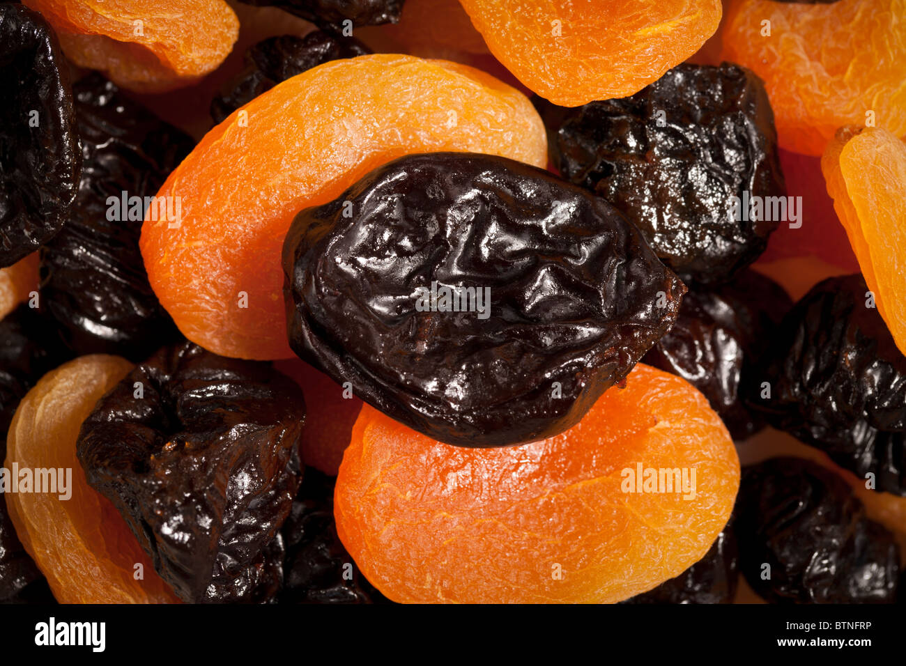 Dried prune and apricot background Stock Photo - Alamy