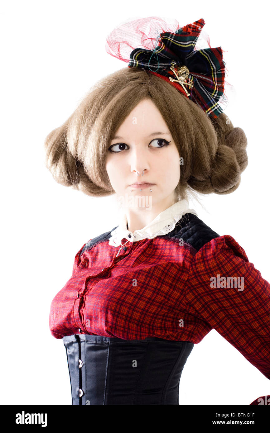 A young goth woman wearing a chequered victorian style dress Stock ...