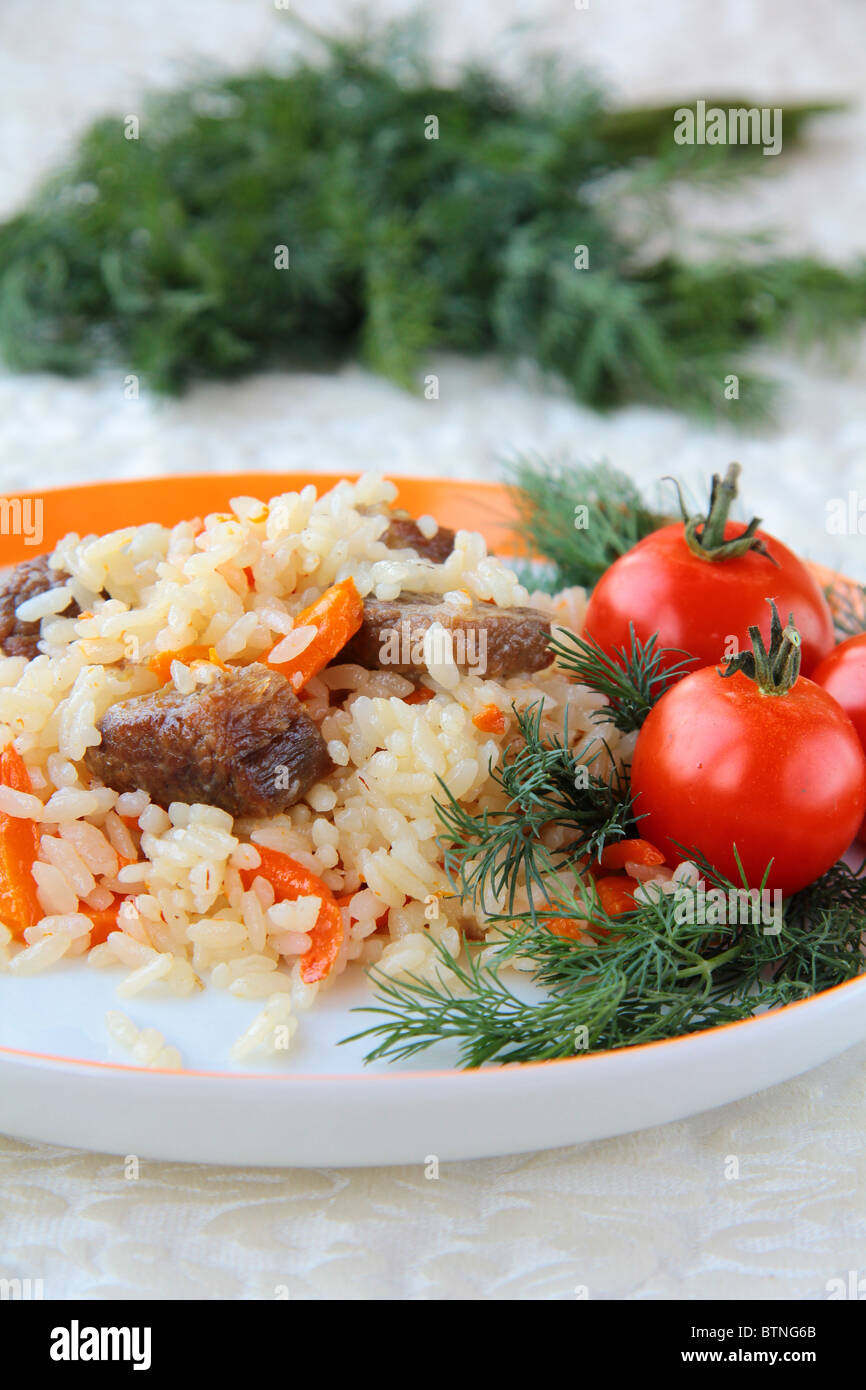Traditional Oriental food pilaf - meat and rice Stock Photo - Alamy