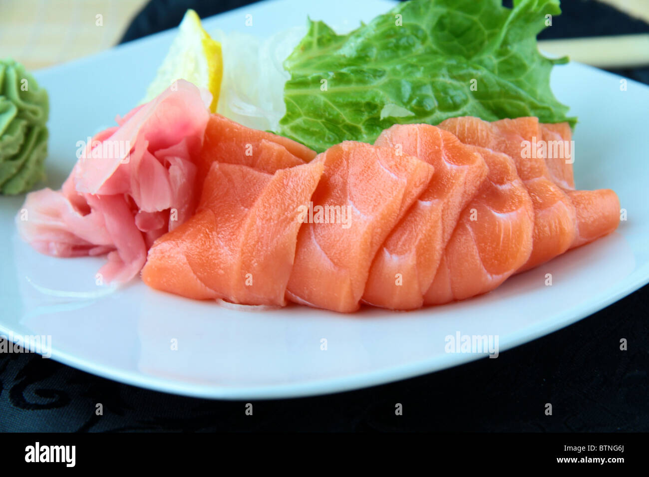 Traditional Japanese food on a square plate Stock Photo - Alamy