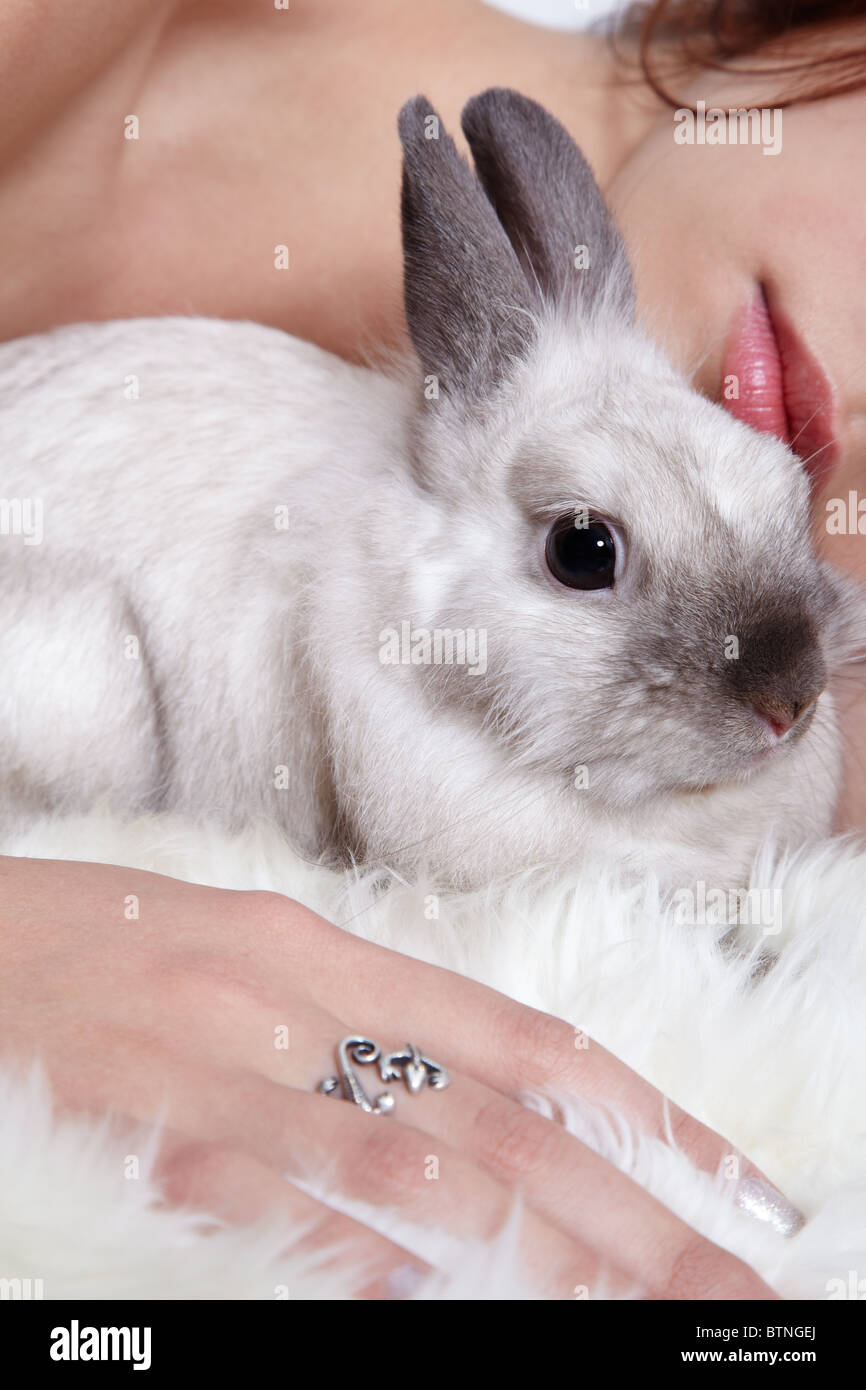 Girl sleeping with his pet pygmy rabbit Stock Photo - Alamy