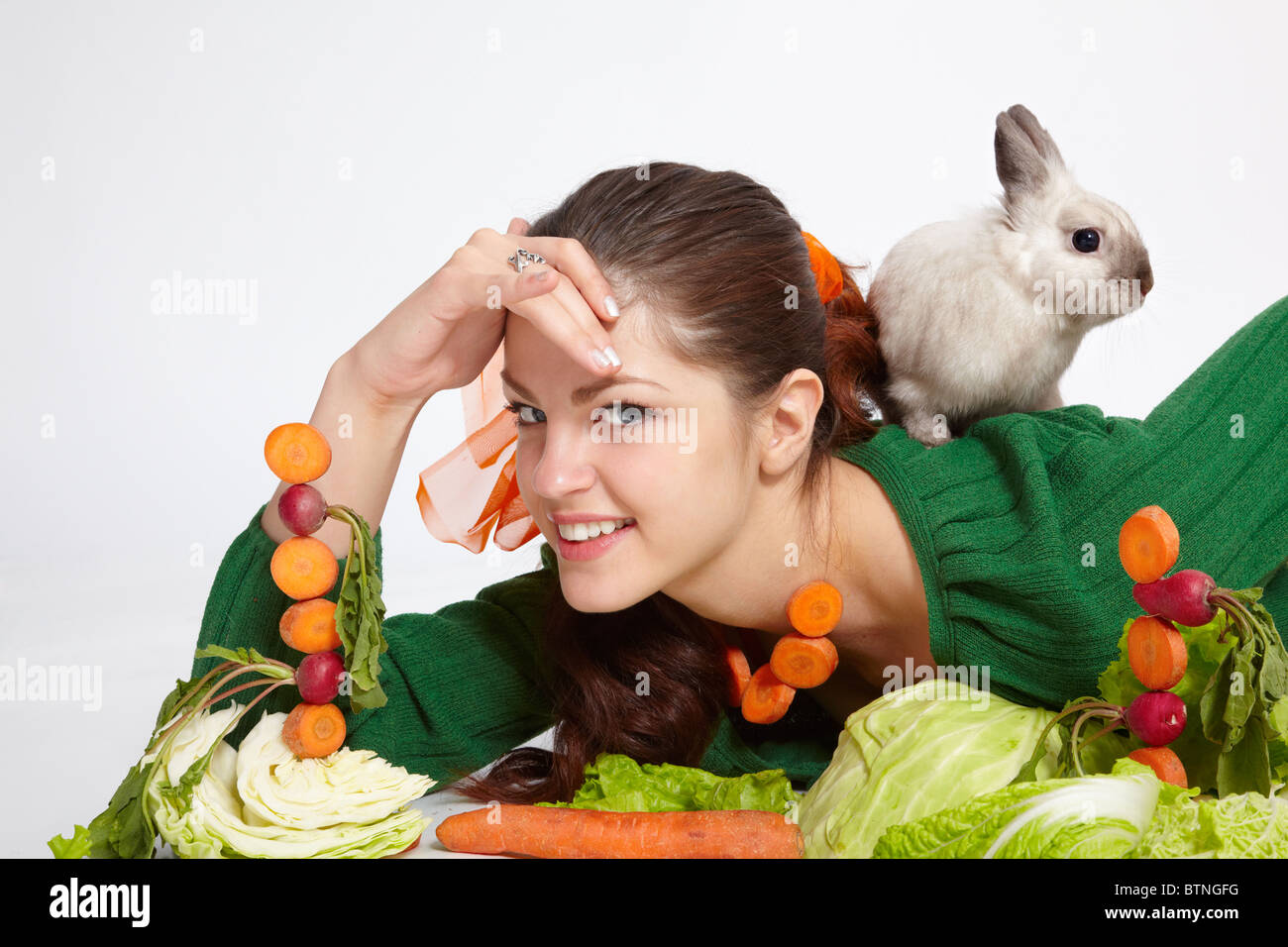 Happy girl with her lovely pet - pygmy rabbit Stock Photo - Alamy