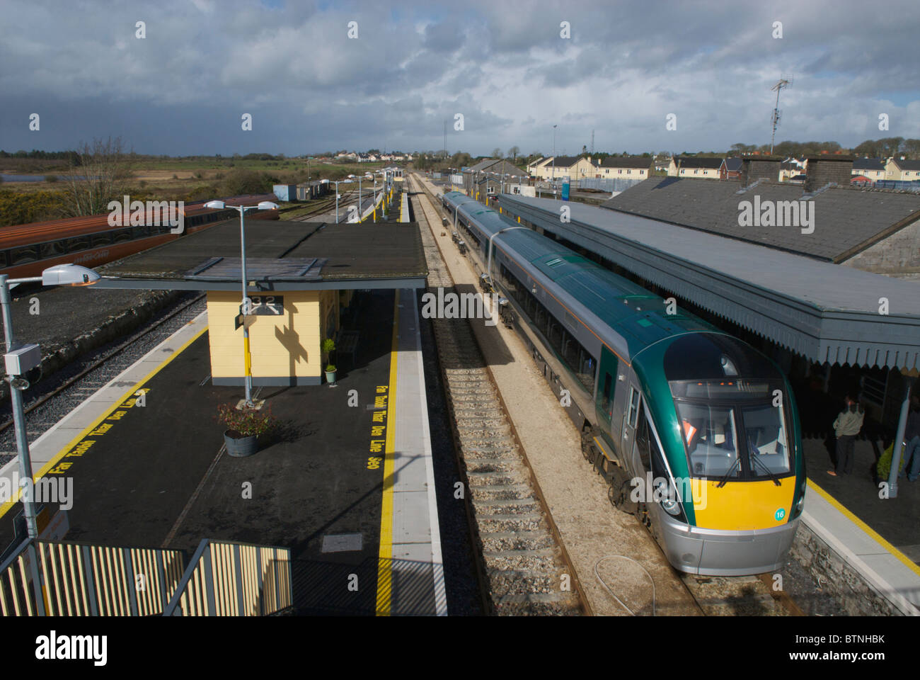 An Irish Rail Train Standing At The Platform At Claremorris Station Co an-irish-rail-train-standing-at-the-platform-at-claremorris-station-co