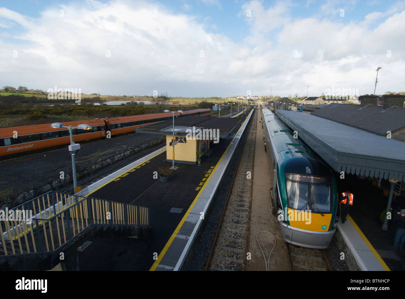 An Irish Rail train standing at the platform at Claremorris station, Co ...