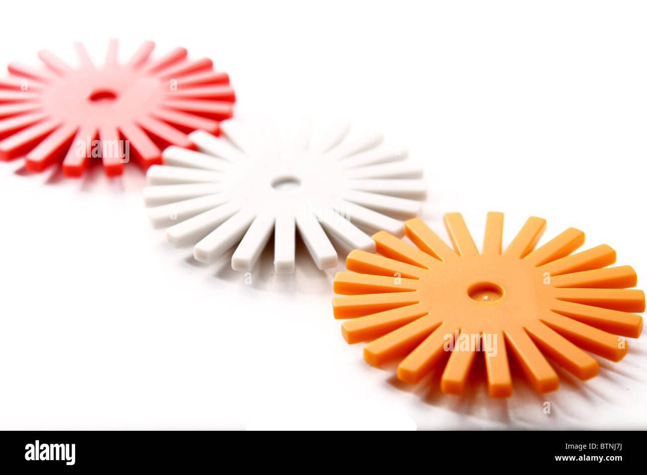 plastic gear wheel on white Stock Photo - Alamy