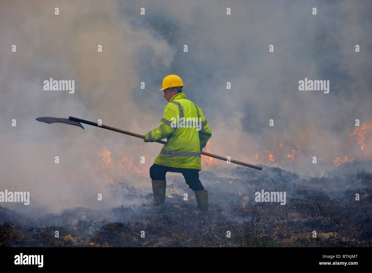 A volunteer Fireman fighting a forest fire in County Mayo, Ireland ...