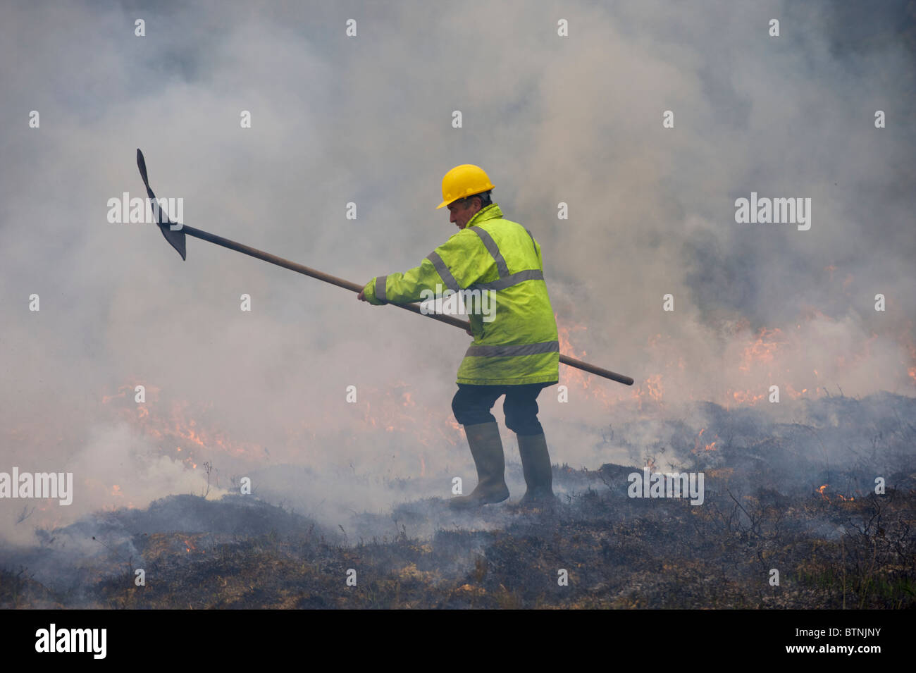 A volunteer Fireman fighting a forest fire in County Mayo, Ireland ...