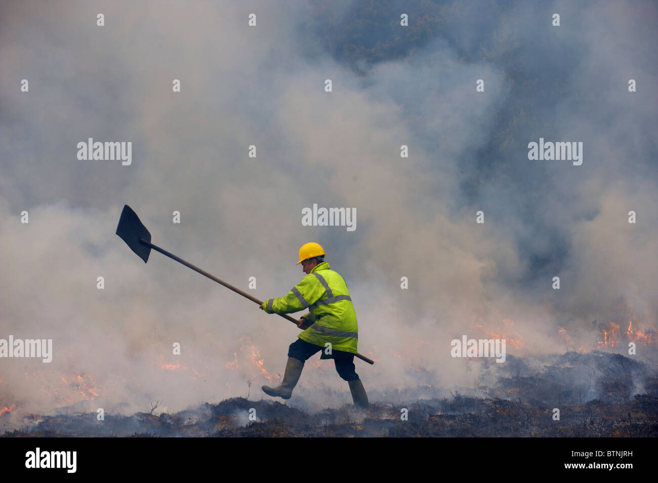 A volunteer Fireman fighting a forest fire in County Mayo, Ireland ...