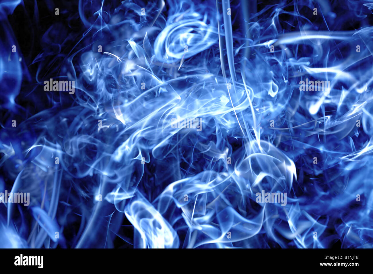 abstract blue smoke against black background Stock Photo - Alamy