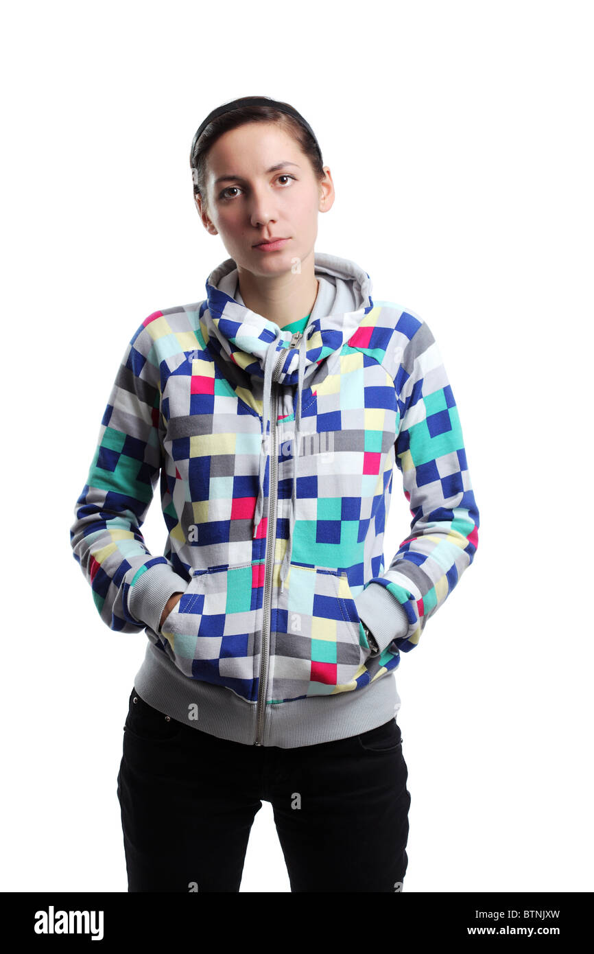 serious looking girl standing against white background Stock Photo - Alamy