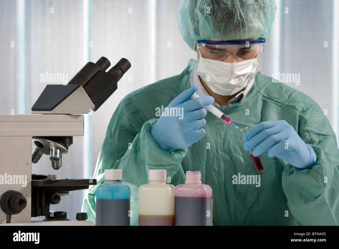 Young man scientist in chemistry bright lab Stock Photo - Alamy