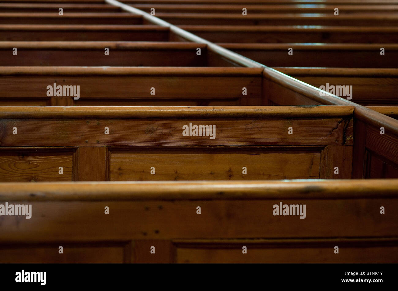 Rows of wooden pews in a church or chapel Stock Photo - Alamy