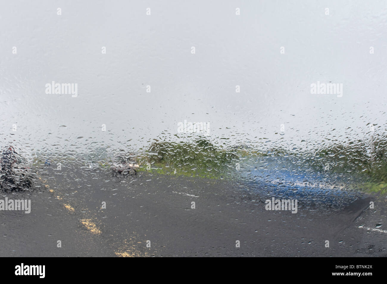 View through a rain covered car windscreen Stock Photo - Alamy