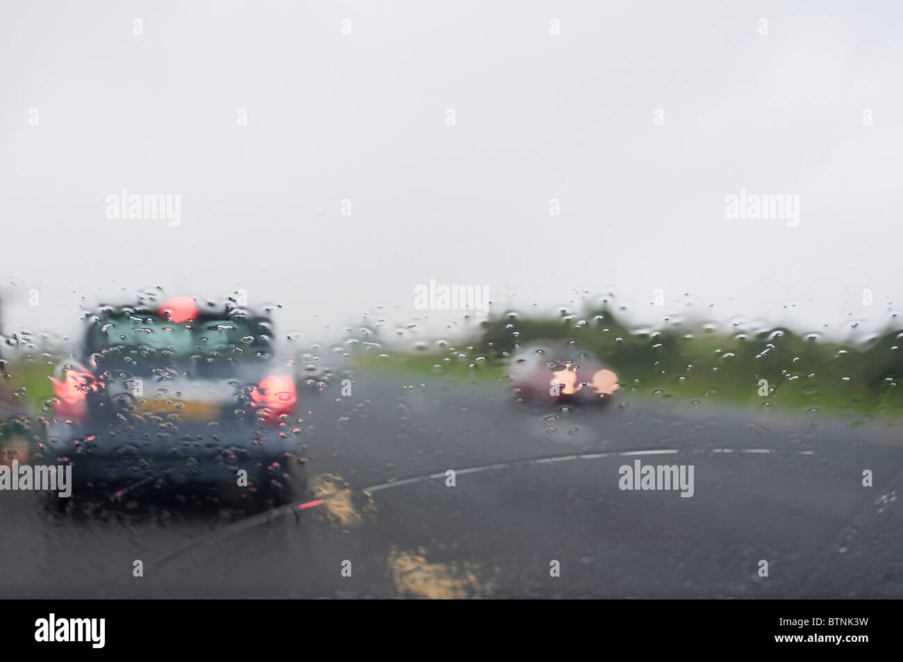 View through a rain covered car windscreen Stock Photo - Alamy