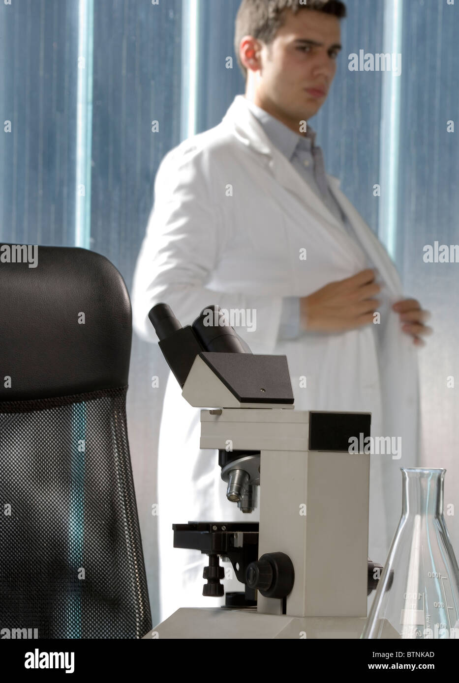 Scientist using a microscope Stock Photo - Alamy