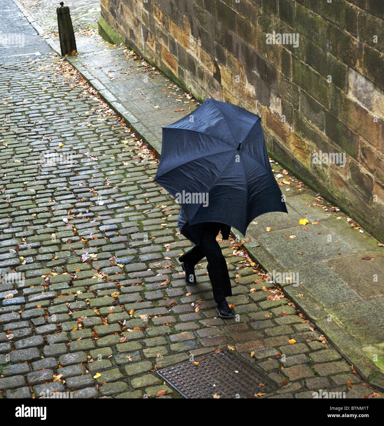 Struggling with wind hi-res stock photography and images - Alamy
