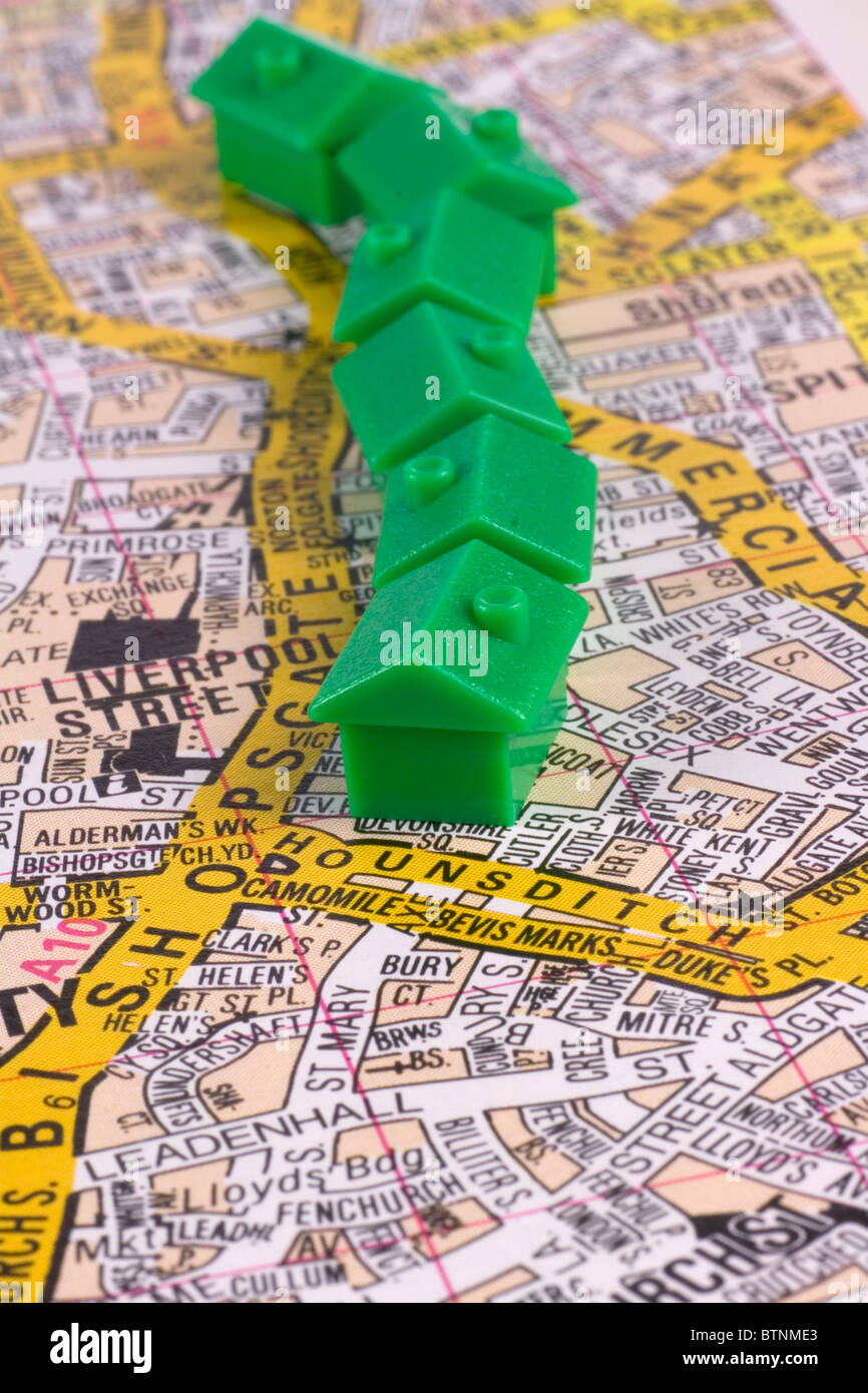 A row of Monopoly houses on a street map Stock Photo - Alamy