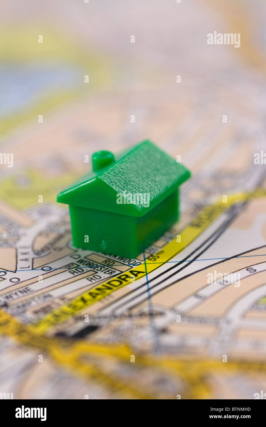 Monopoly house on a street map Stock Photo - Alamy