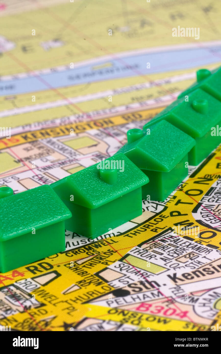 A row of Monopoly houses on a street map Stock Photo - Alamy