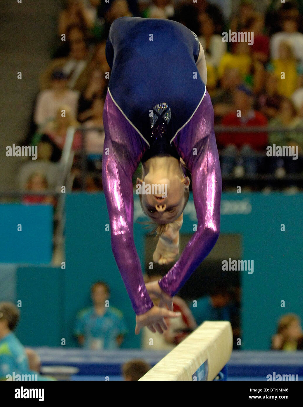 A young female gymnast on the beam Stock Photo - Alamy