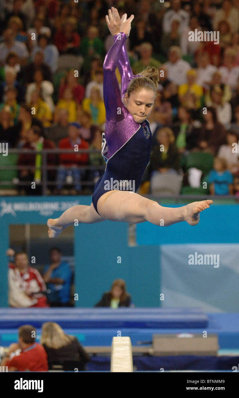 A young female gymnast on the beam Stock Photo - Alamy