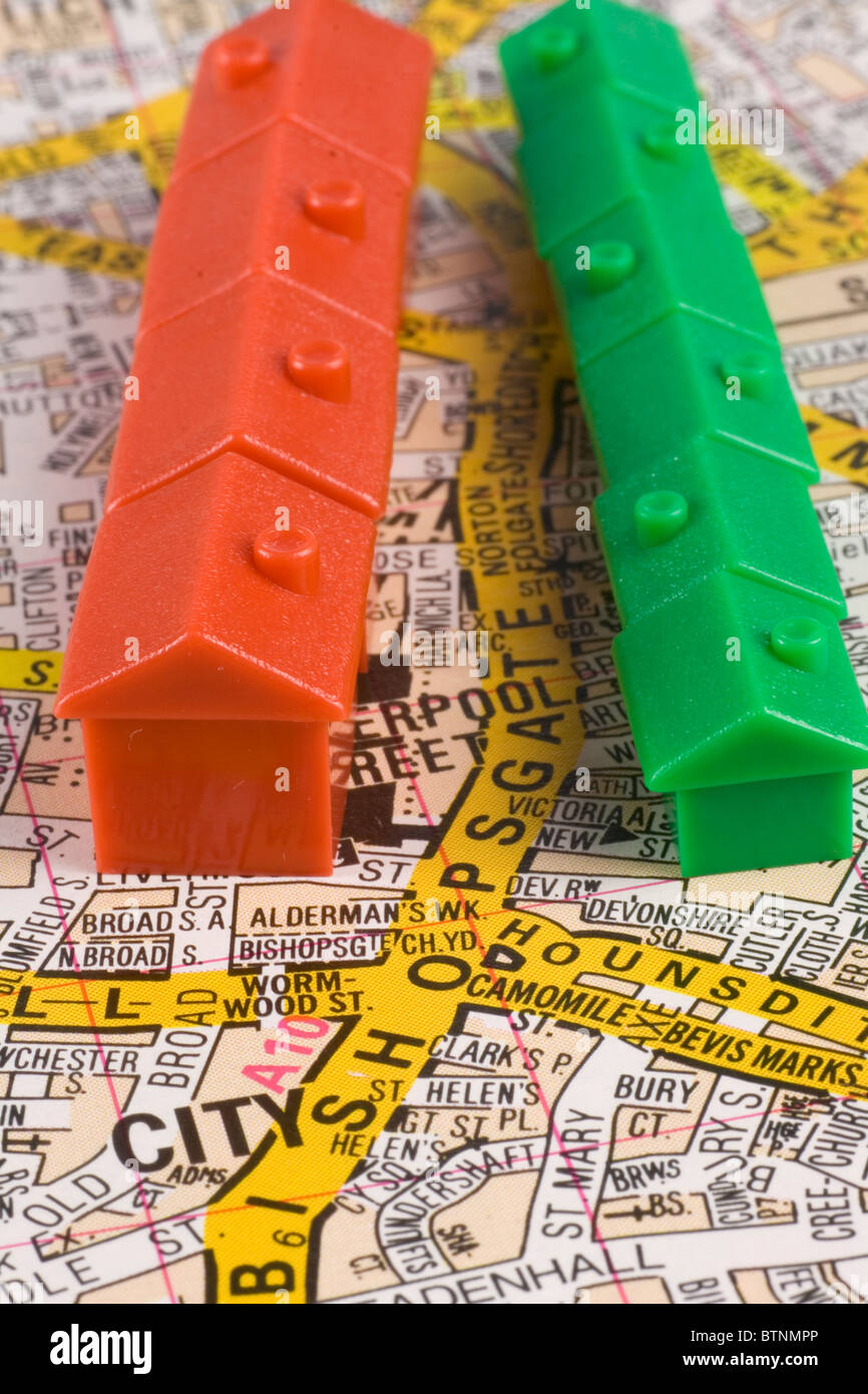 Two rows of Monopoly houses on a street map Stock Photo - Alamy