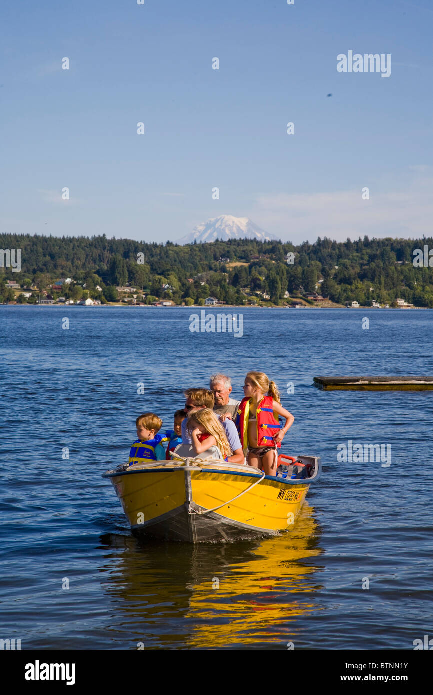 Men and young children on motorboat ride Stock Photo - Alamy