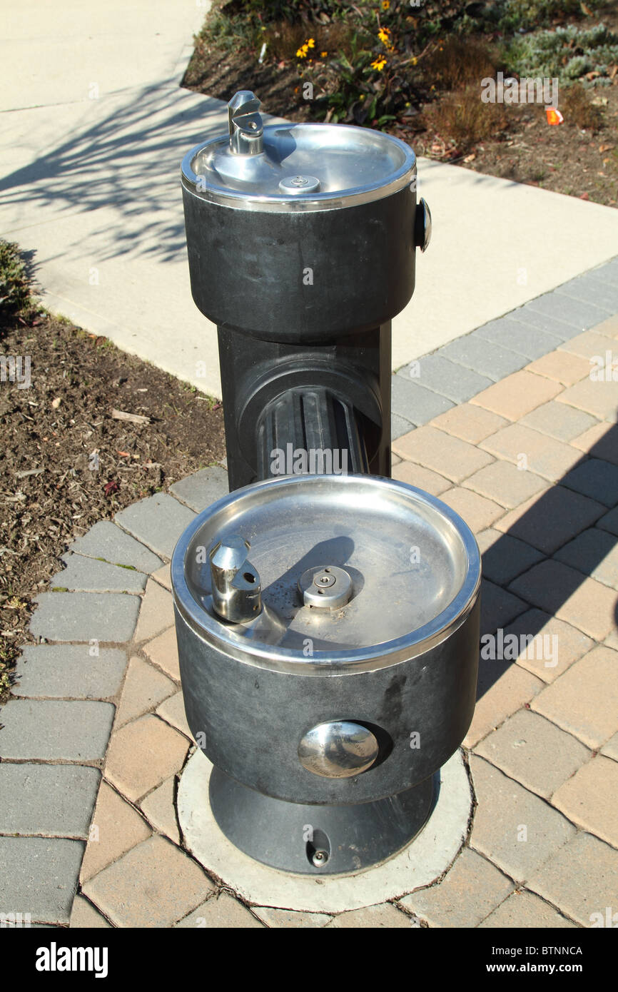 Two water fountains in park Stock Photo - Alamy
