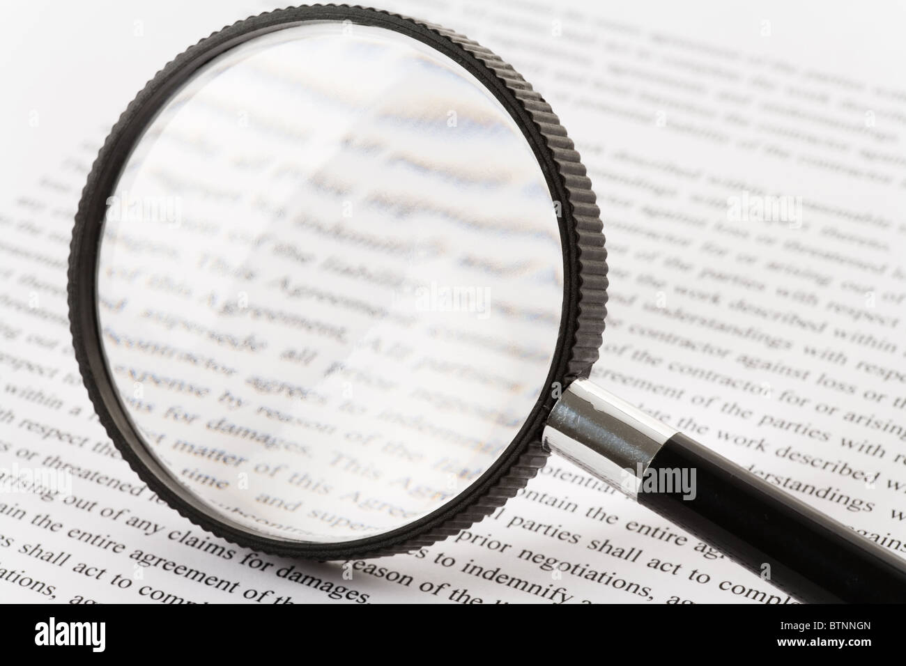 Magnifying Glass and document close up Stock Photo - Alamy