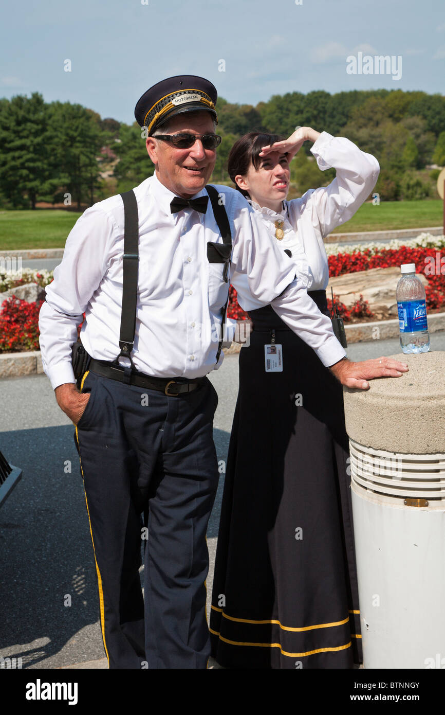 Trolley bus driver and tour guide wait for tourists to return to bus at ...