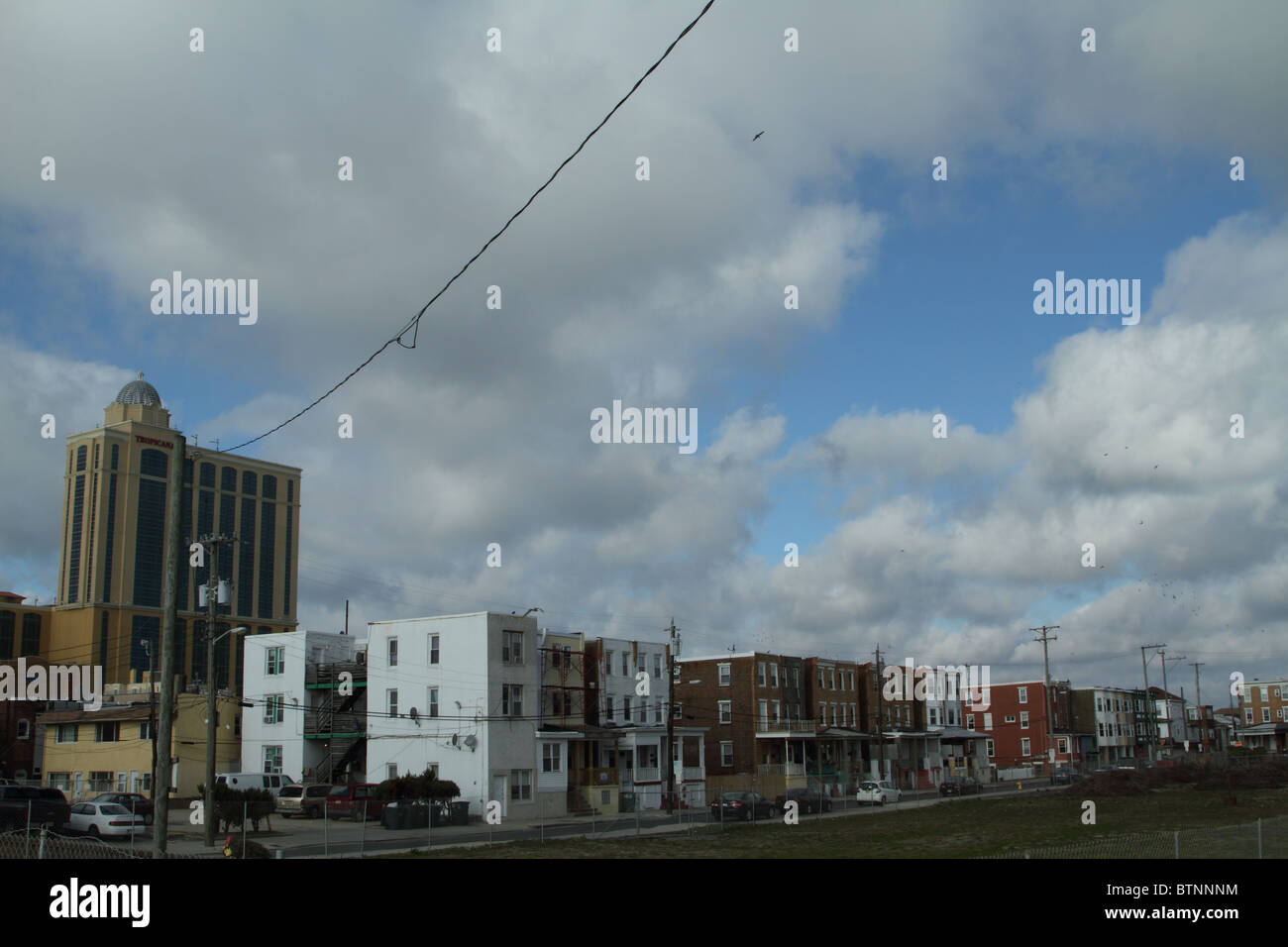 Atlantic City street scene showing the Tropicana casino and row houses ...