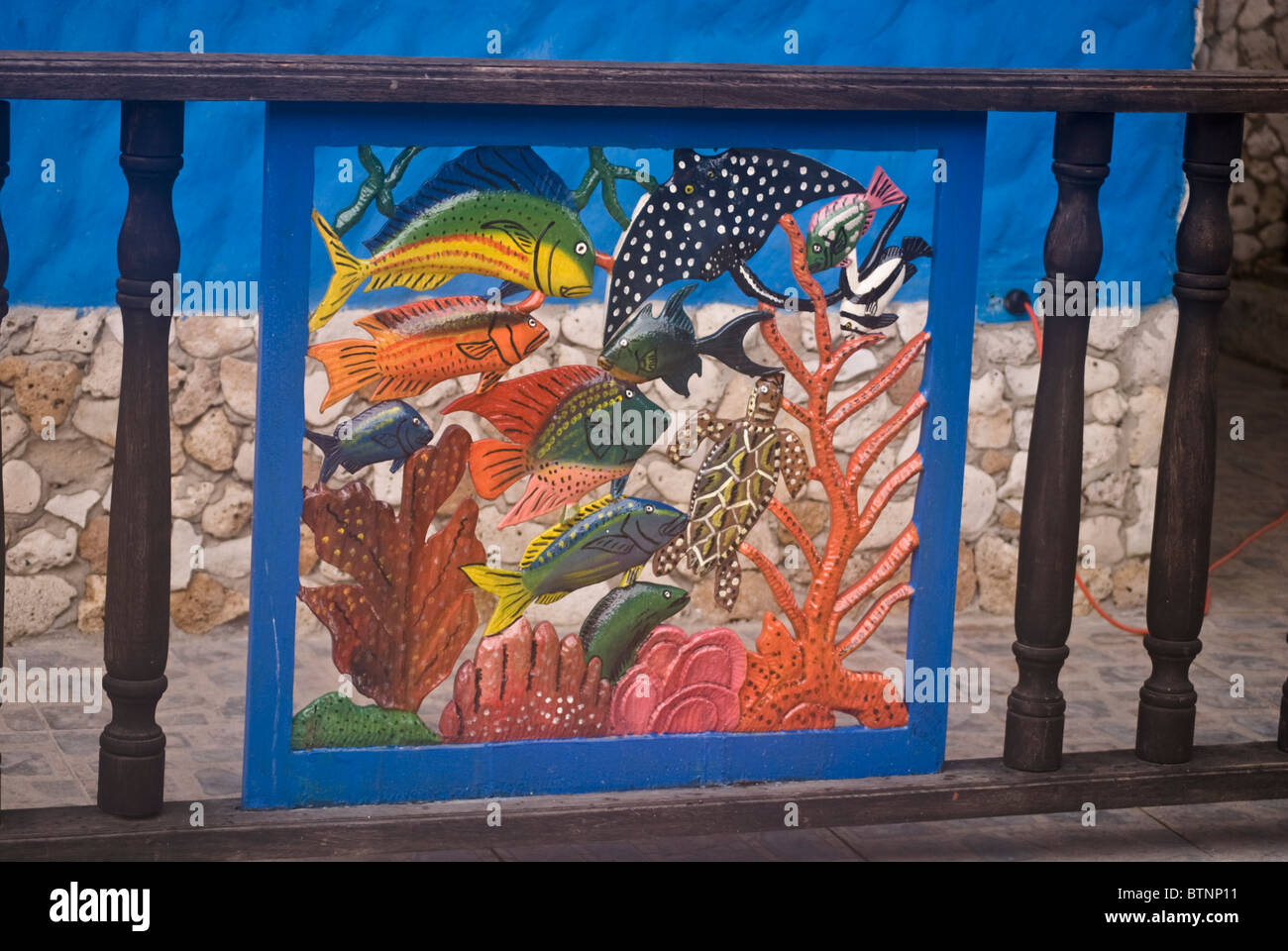 Colourful hand carved gate outside a small aquarium in Baru Stock Photo ...