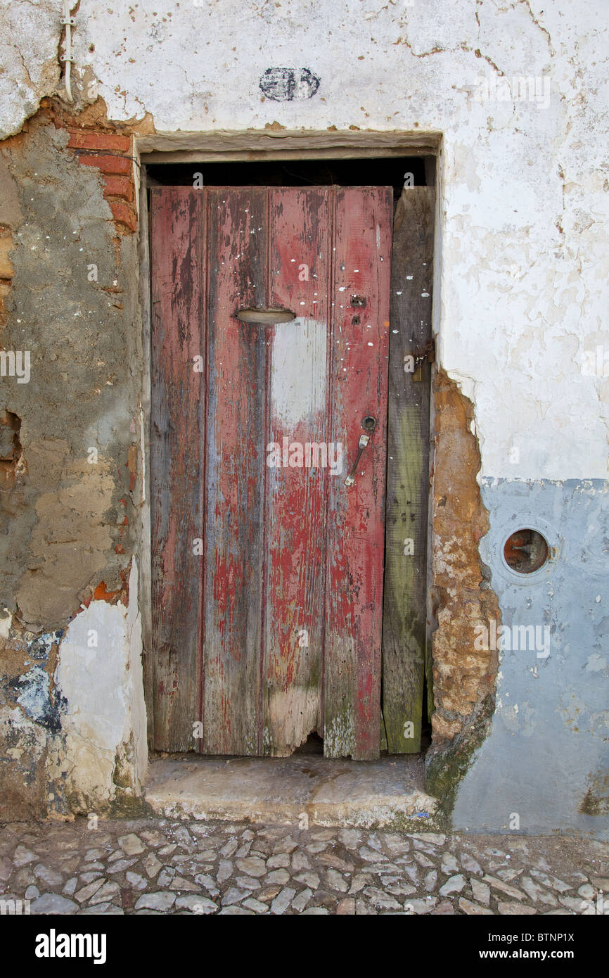 Faded Red Rustic Weathered Wood Door Stock Photo - Alamy