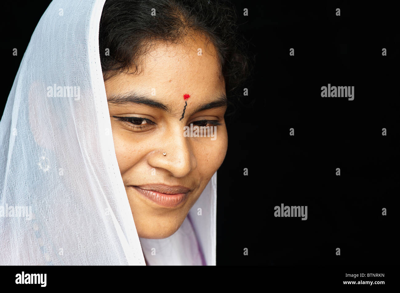 Young Indian woman in a white veil portrait. India Stock Photo - Alamy