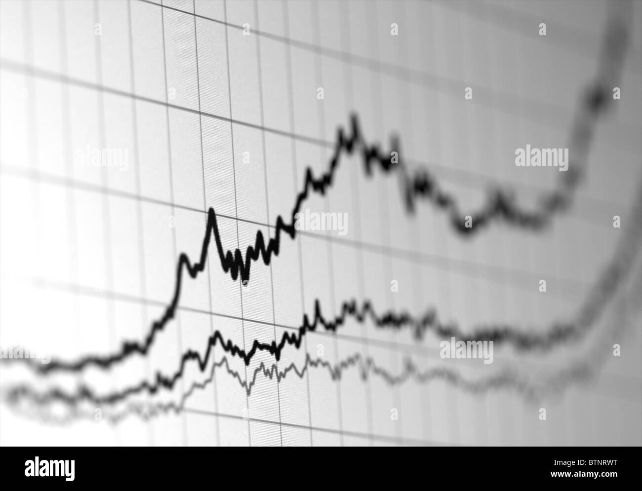 Graph of financial data on a computer monitor showing increasing value. Shallow depth of field ...