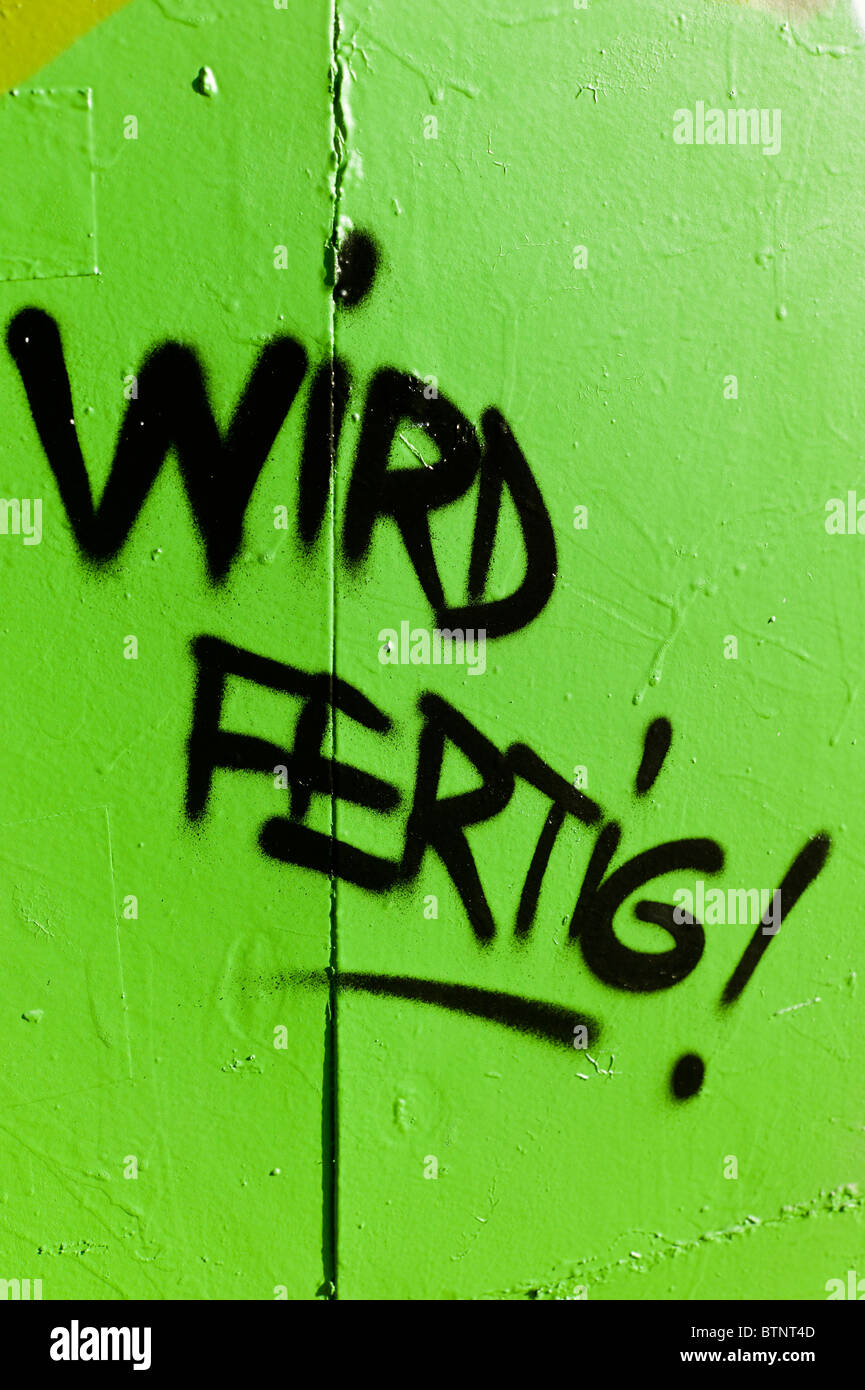 Graffiti with a light green background and the German words 'Wird ...